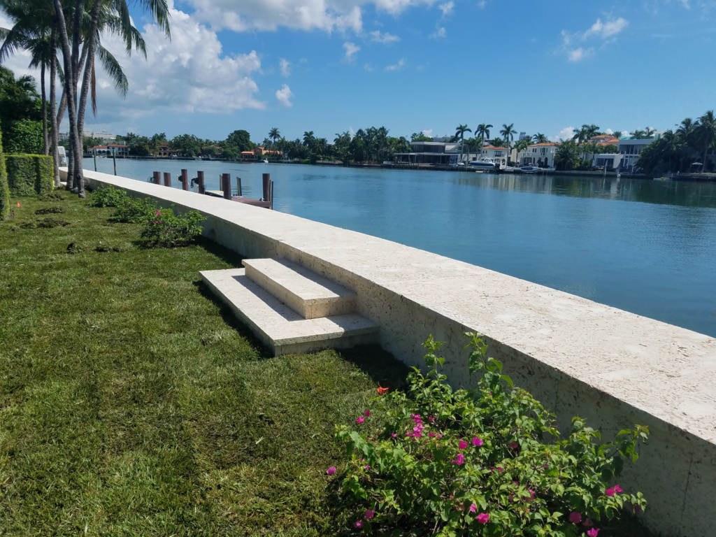 Elegant keystone-faced seawall on Miami Beach - Dock & Marine Construction